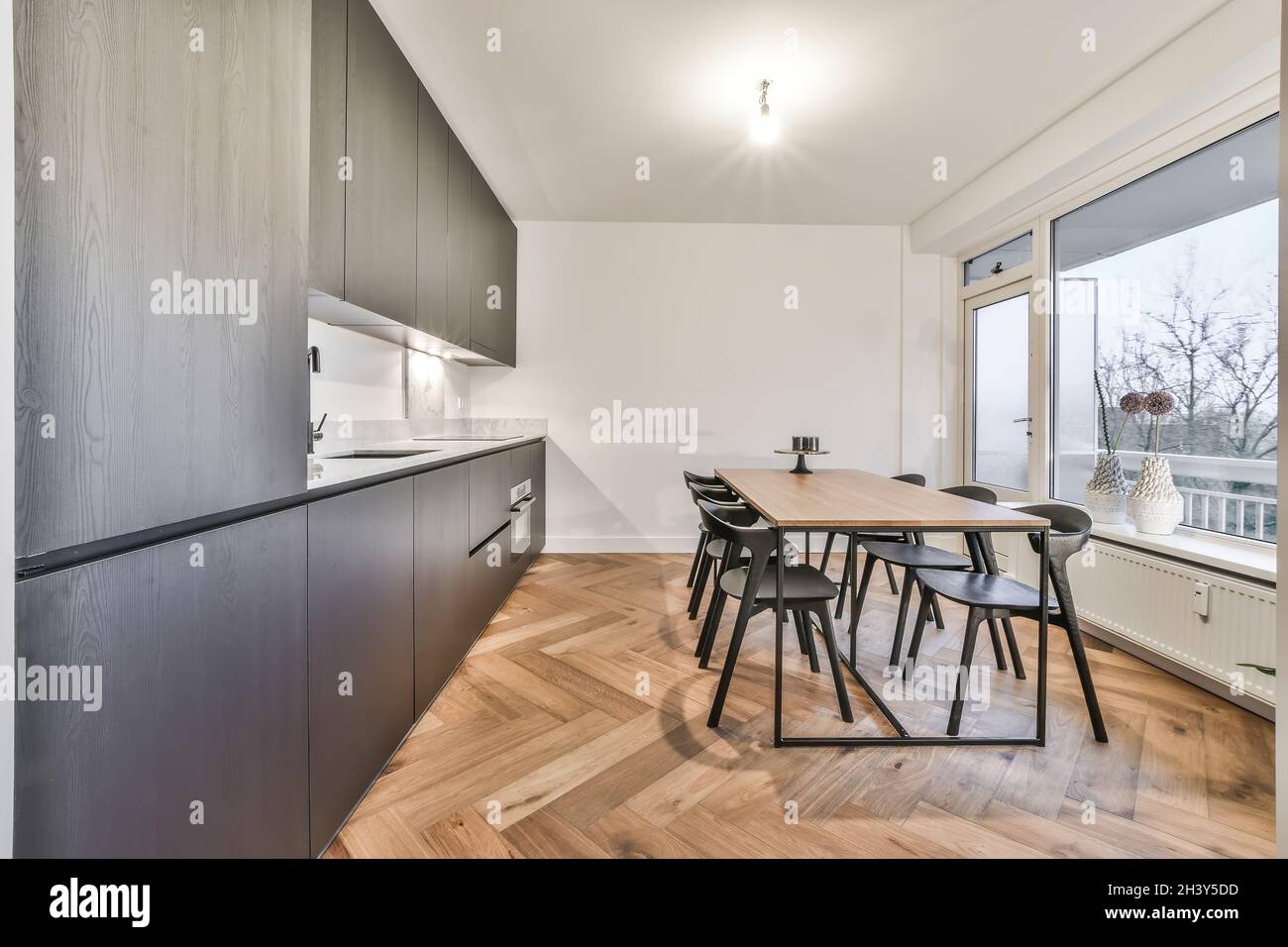 Design of joint kitchen with dining room Stock Photo - Alamy