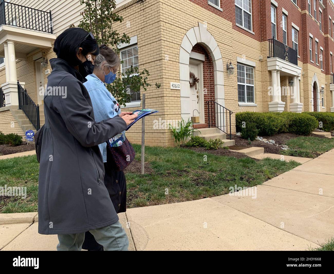 October 30, 2021, Brambleton, Virginia, USA: Volunteers Marcia Lim and ...