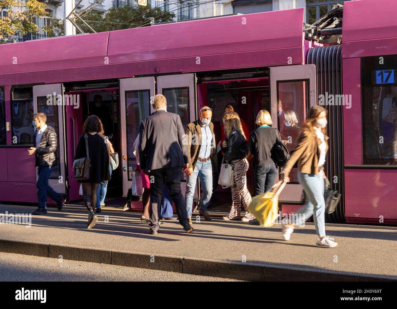 passengers getting on and off a tram, Rue de Rive, Geneva, Switzerland ...