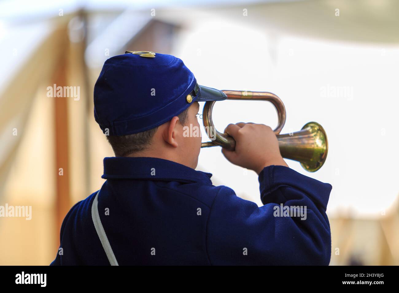Gettysburg, PA, USA - July 2, 2016: A boy plays a bugle as an army ...