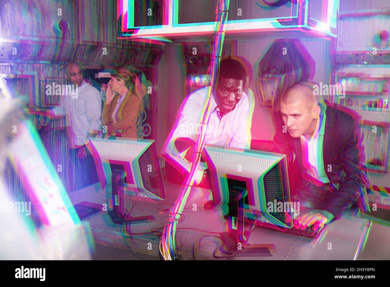 Two men solving puzzle in escape room Stock Photo - Alamy