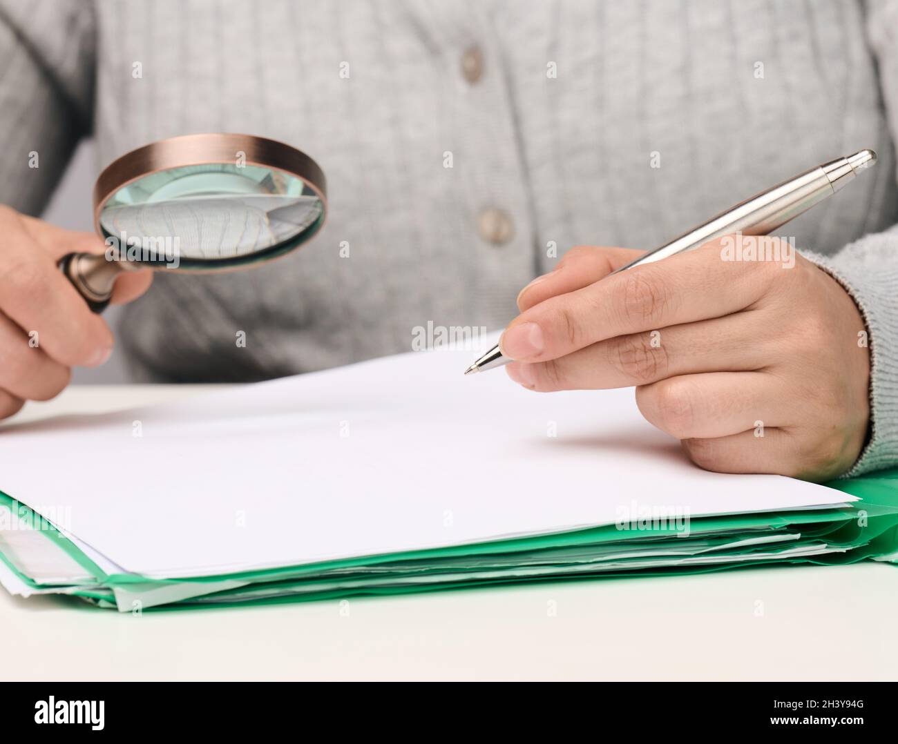 Magnifying glass over contract hi-res stock photography and images - Alamy