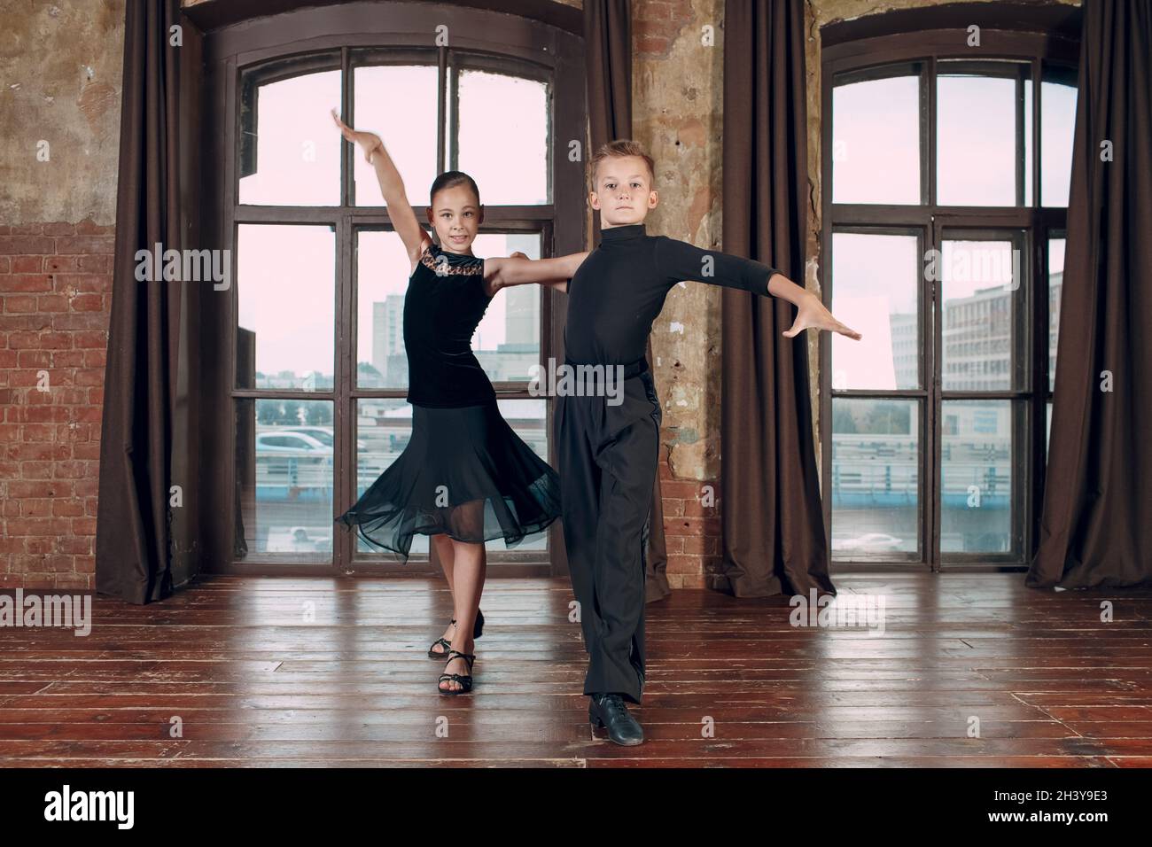 Young couple boy and girl dancing ballroom dance Rumba Stock Photo - Alamy
