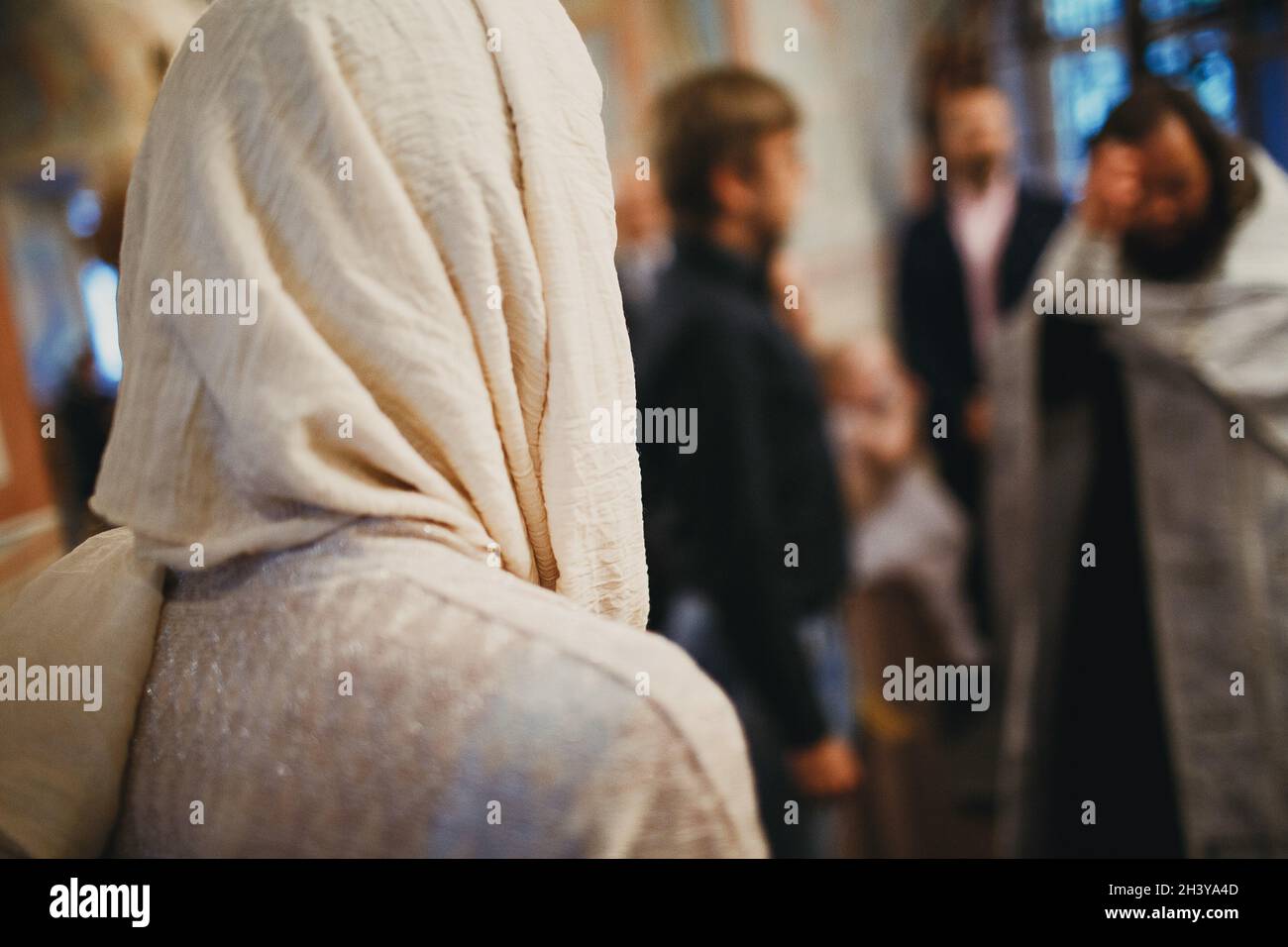 Orthodox Christian priest and parishioner praying in the church Stock ...