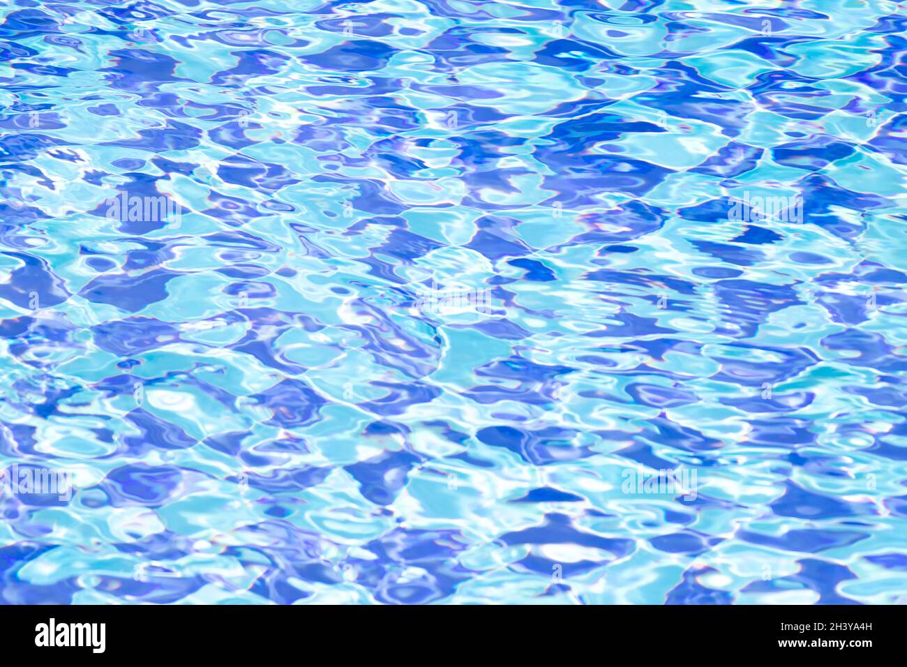 Ripple Water in swimming pool with blue tile floor background Stock ...