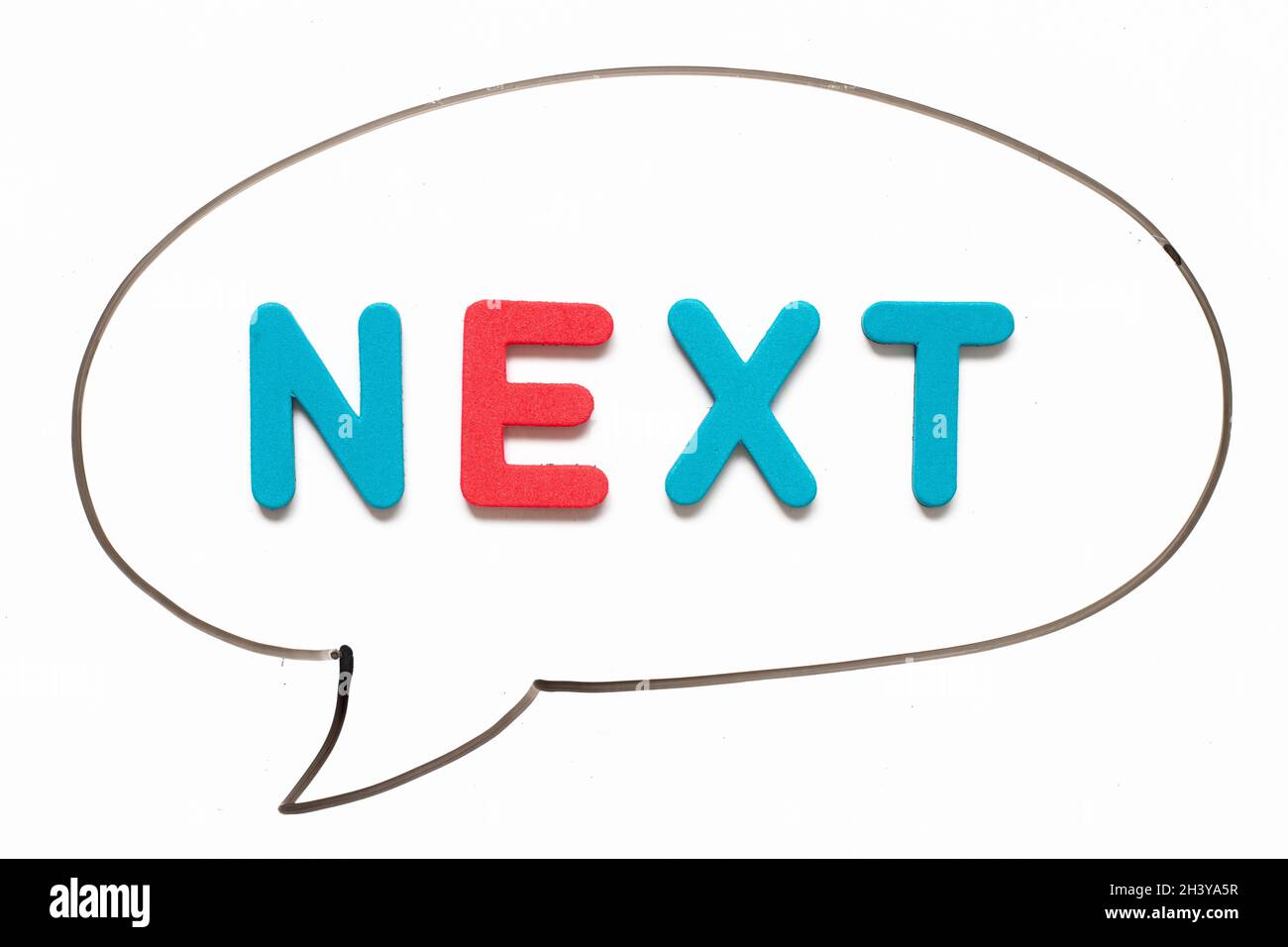 Alphabet letter with word next in black line hand drawing as bubble ...