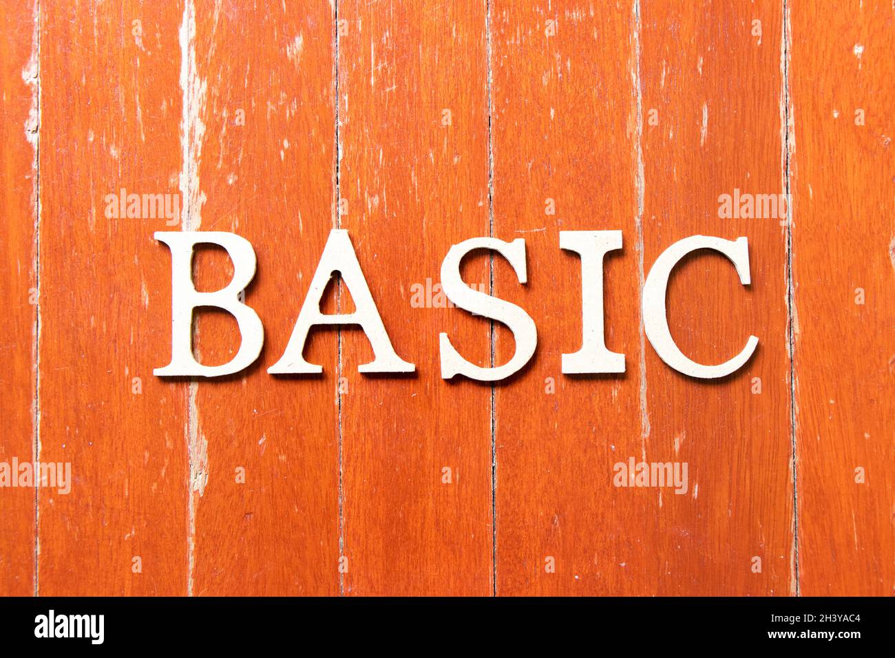 Alphabet letter in word basic on old red color wood plate background ...