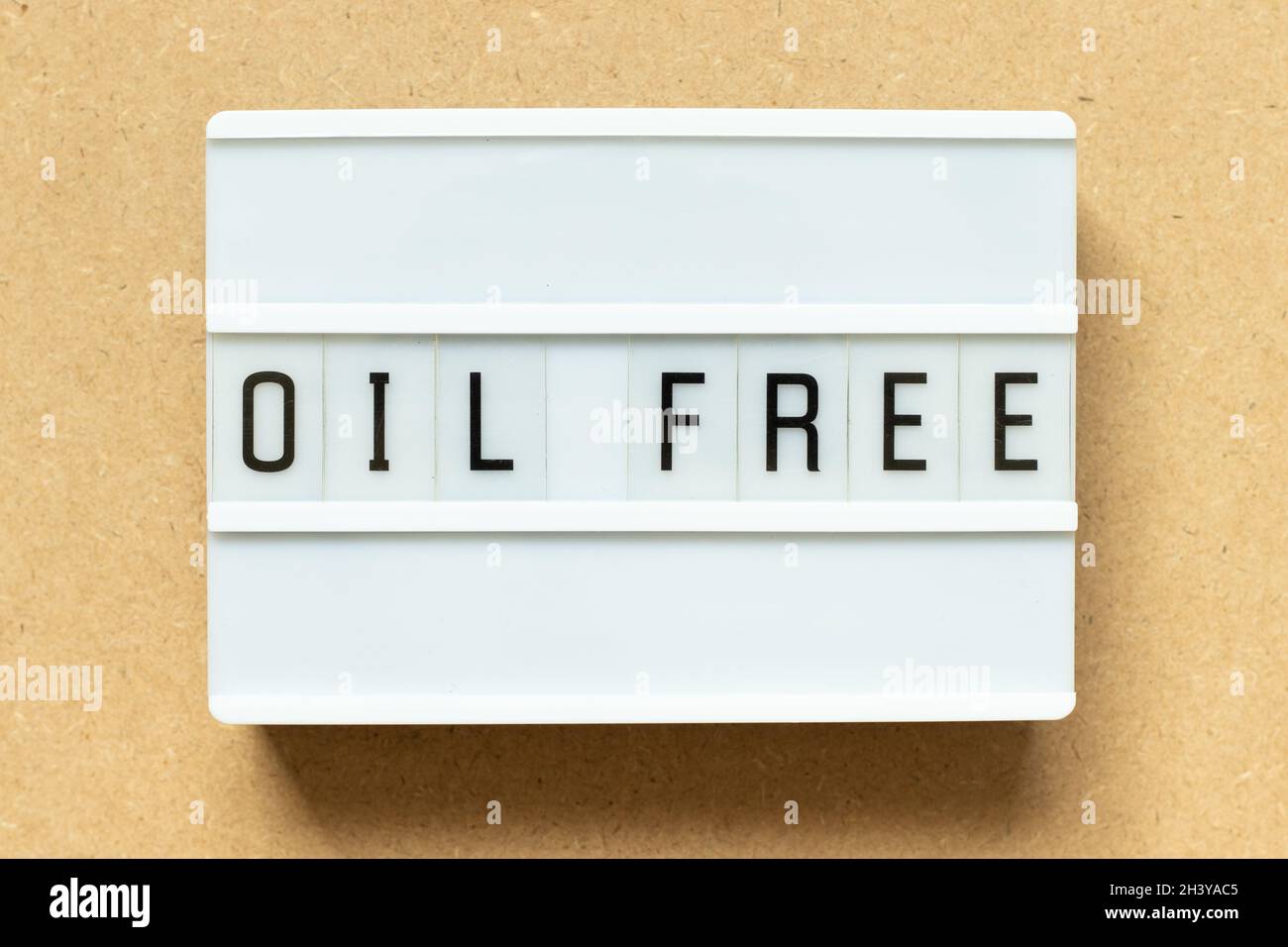 Lightbox with word oil free on wood background Stock Photo - Alamy