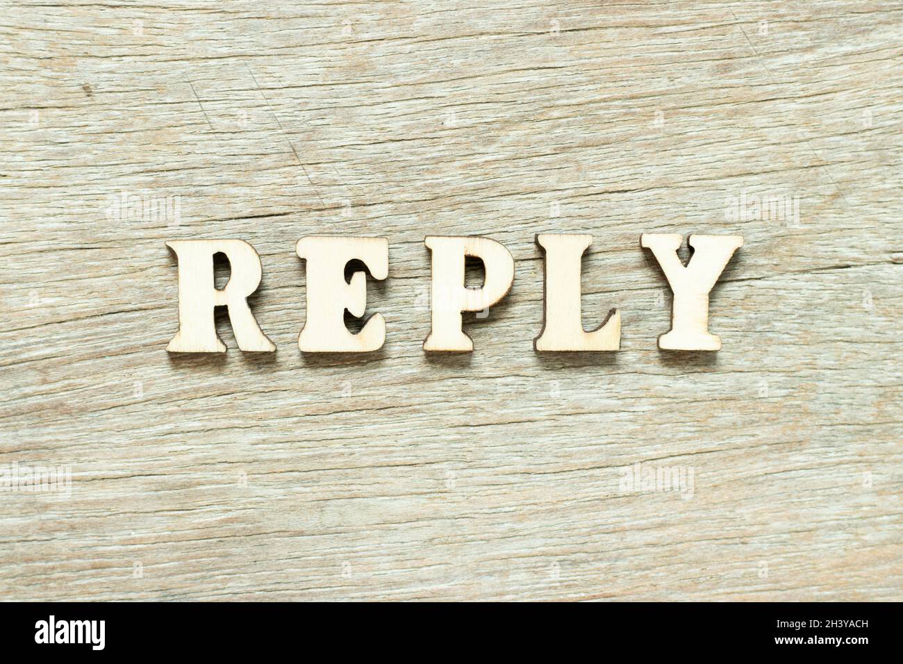 Alphabet letter in word reply on wood background Stock Photo - Alamy