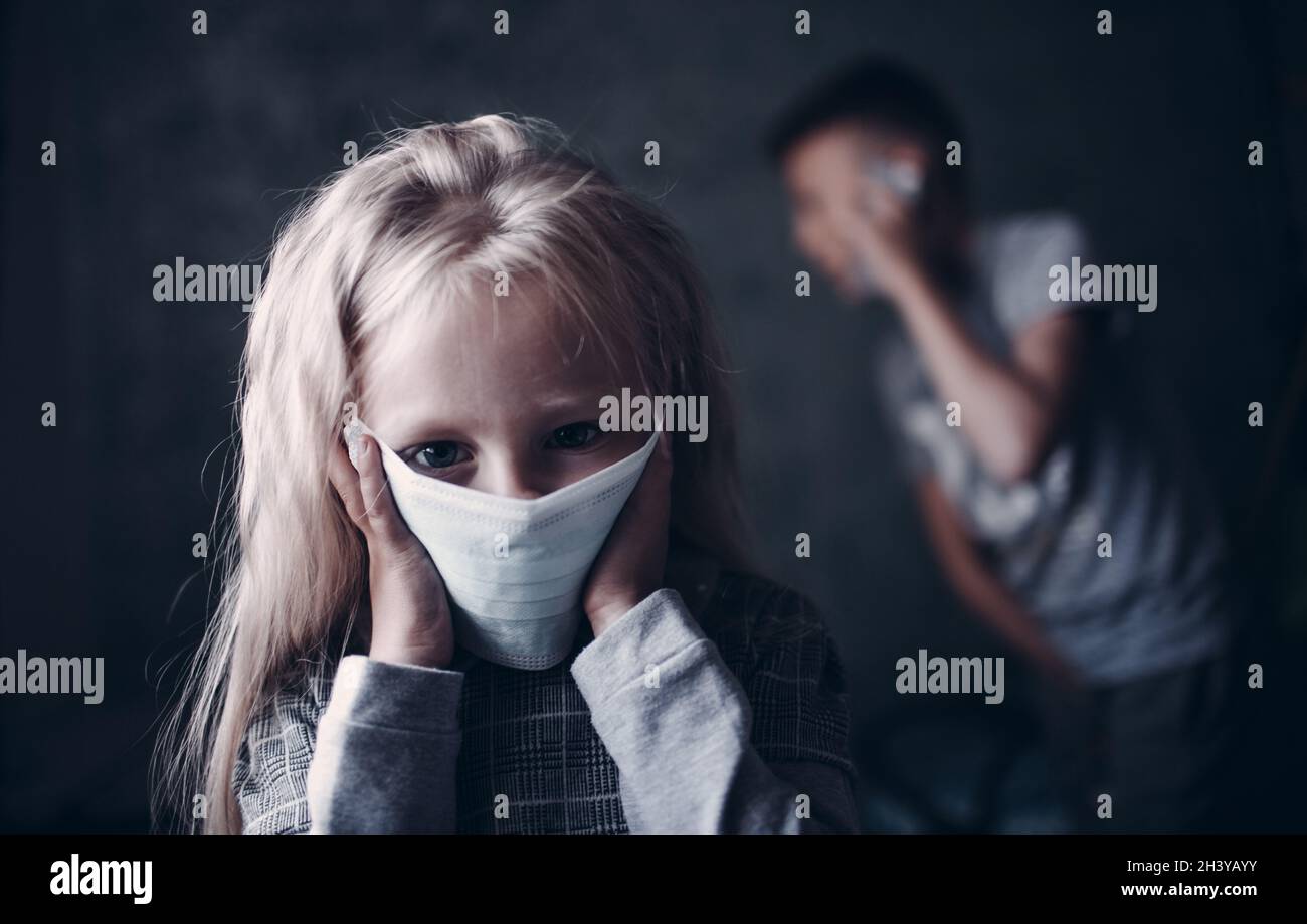 Portrait of sad little girl wearing medical face mask, virus protection ...