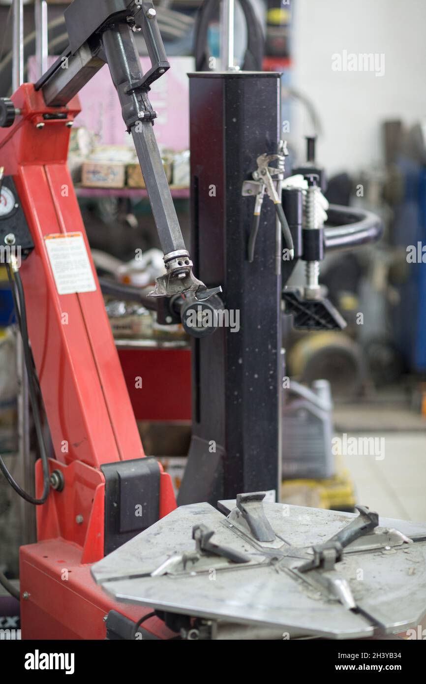 Machine for changing car tire fitting. Wheel tyre repairing Stock Photo ...