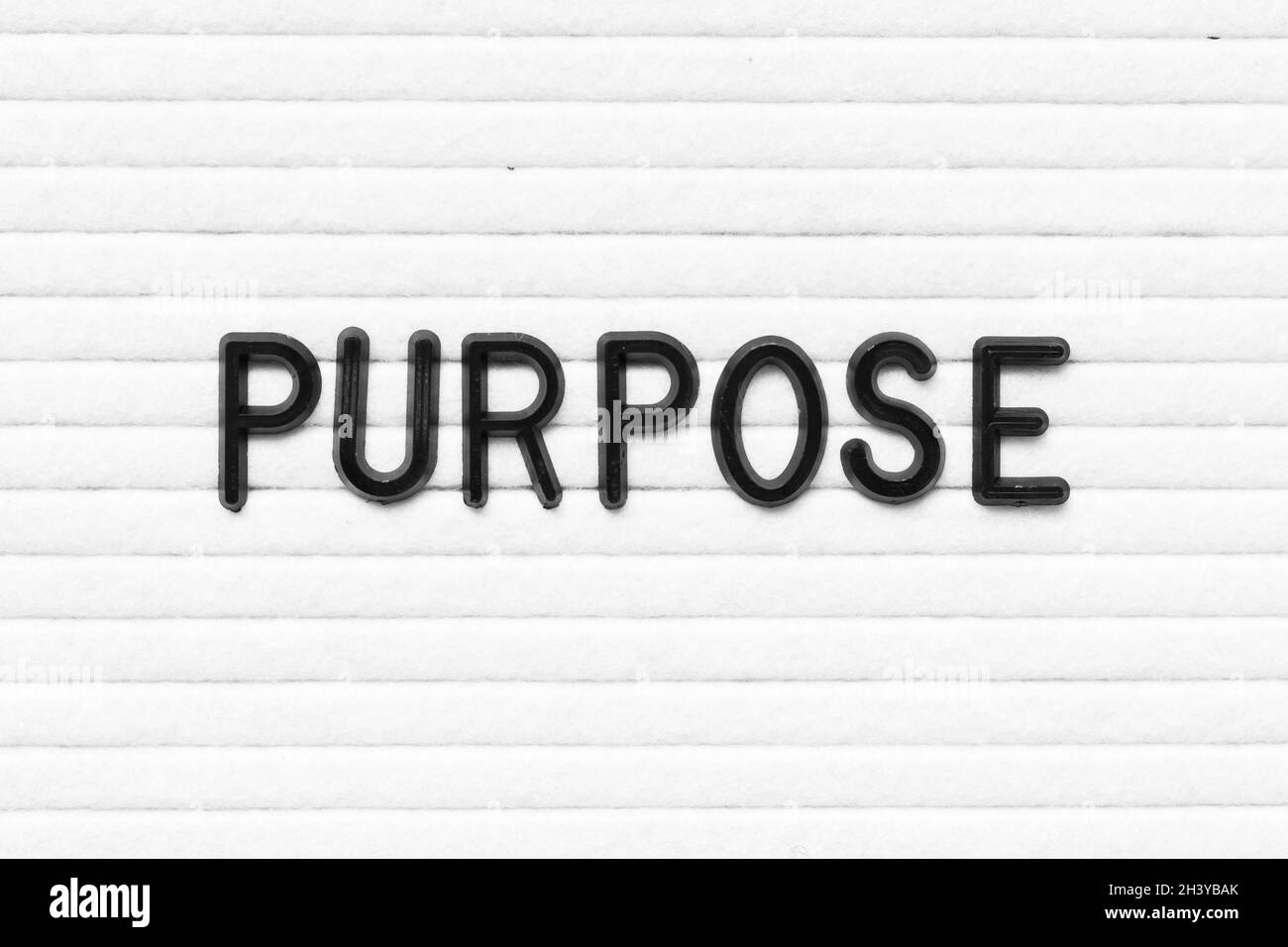 Black letter in word purpose on white felt board background Stock Photo ...
