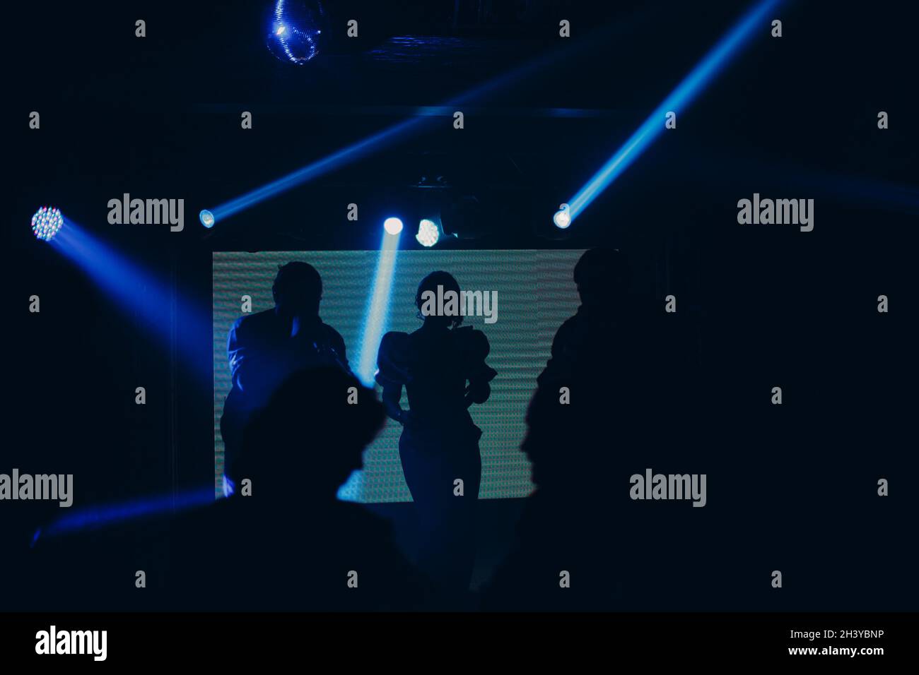 Silhouettes of a crowd on show in night club celebration Stock Photo ...