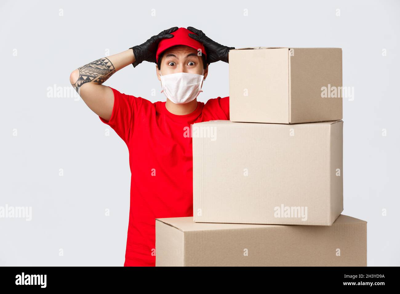 Nervous asian delivery guy got lots of orders to deliver, grab head in ...