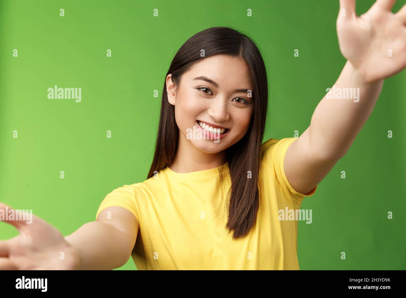 Close Up Cheerful Cute Asian Friendly Woman Spread Hands Holding Camera Both Arms Smiling