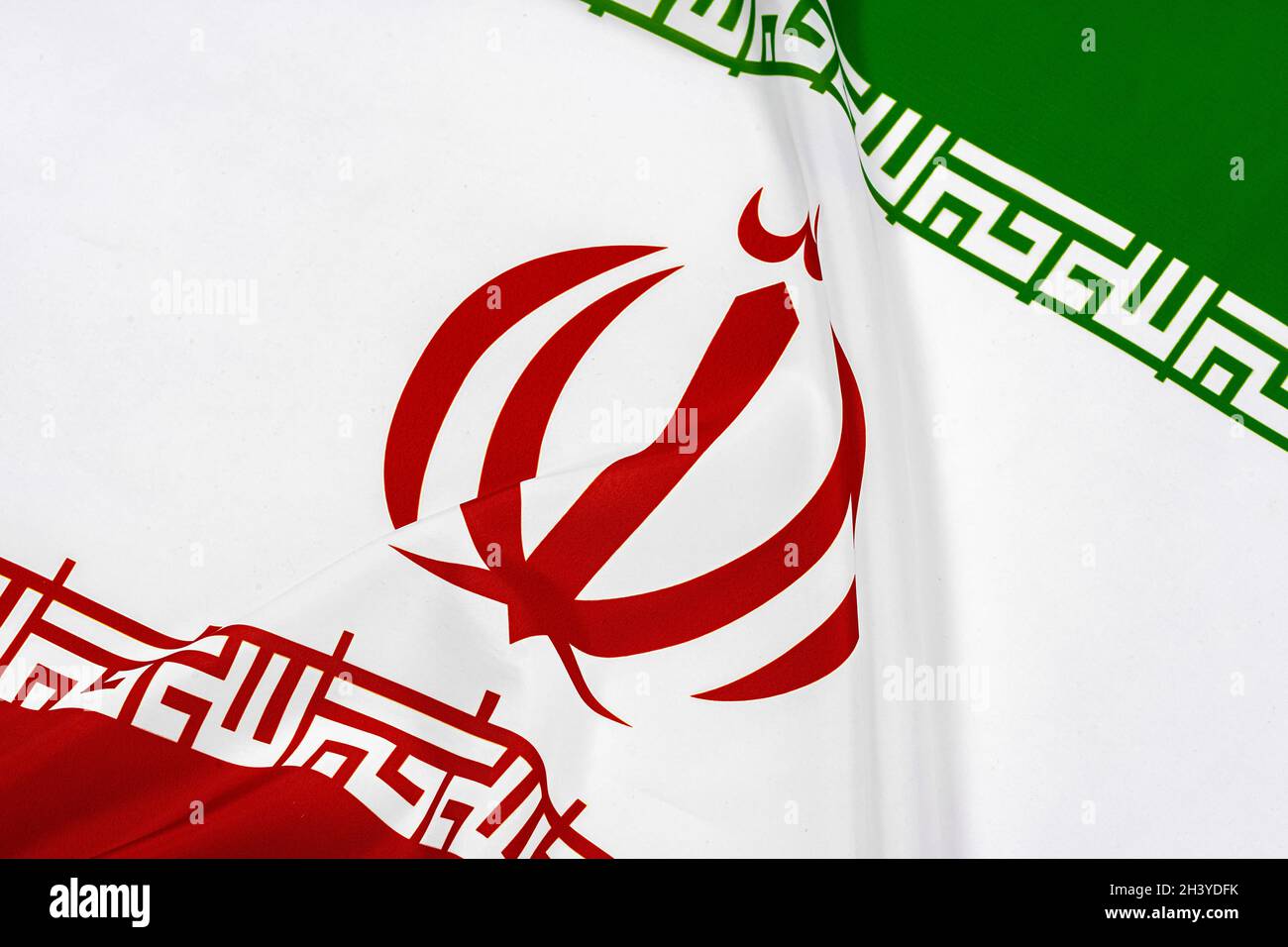 Photo of fabric flag of Iran close up Stock Photo - Alamy