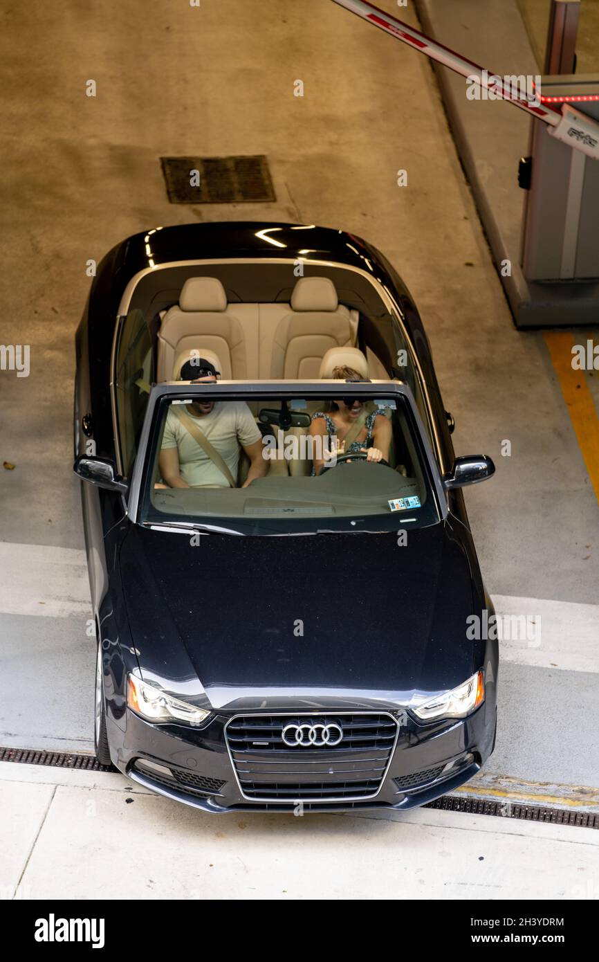 Miami, FL, USA - October 30, 2021: Photo of a couple exiting a parking ...