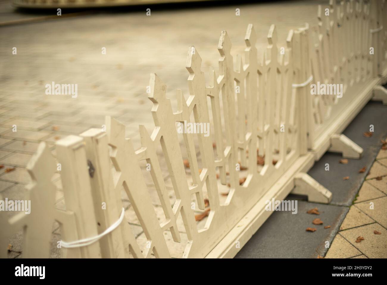 White fence. Small fence. Obstacle for pedestrians in the park Stock ...