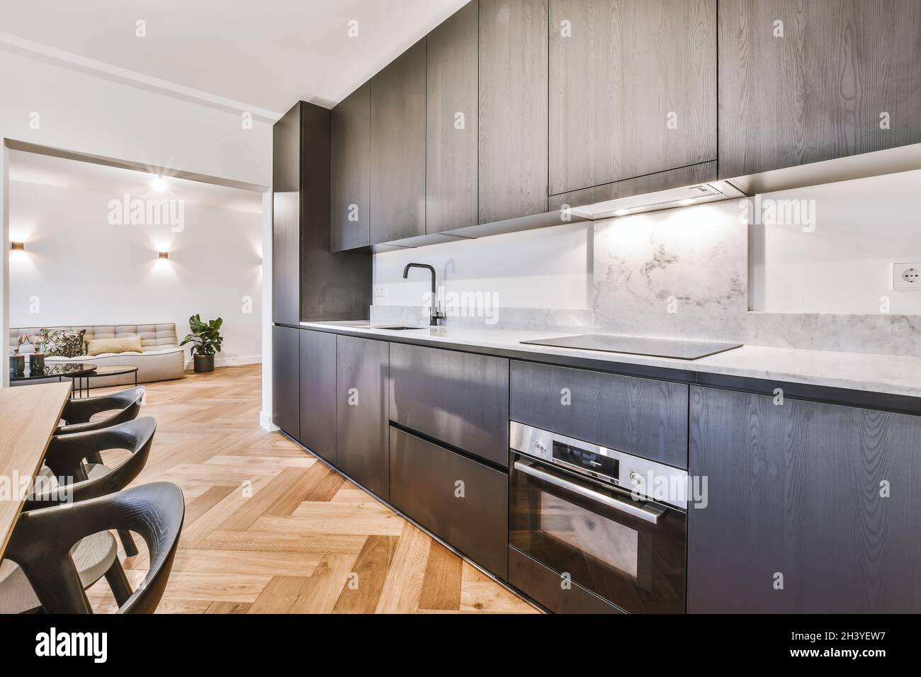 Design of joint kitchen with dining room Stock Photo - Alamy