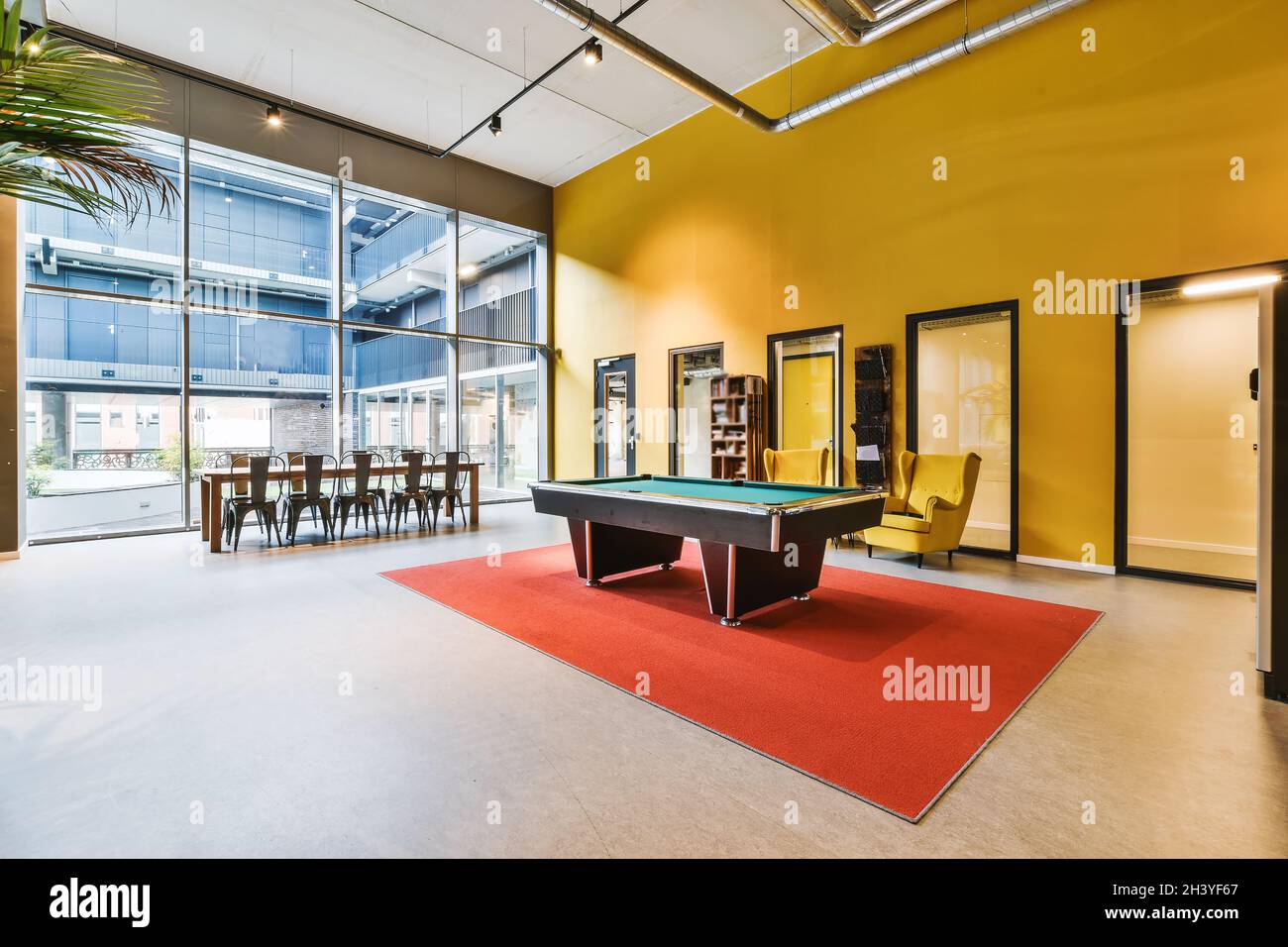 Interior of a building with a pool table Stock Photo - Alamy