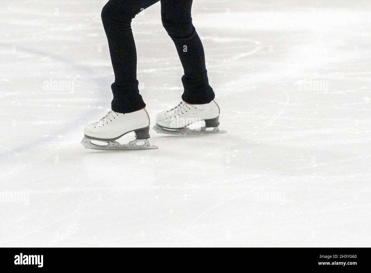 View of figure skater feet at the figure skating practice Stock Photo ...
