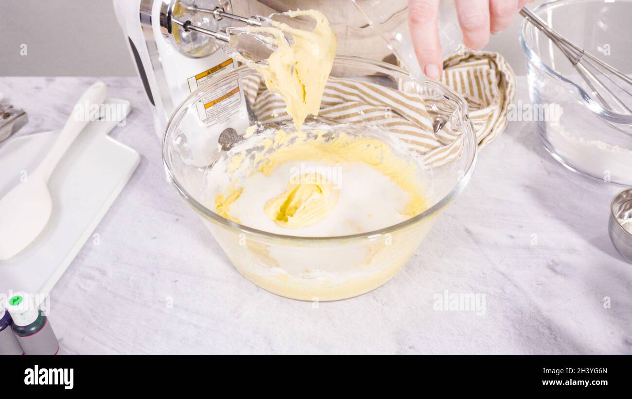 Step by step. Mixing ingredient in a mixing bowl with an electric mixer ...