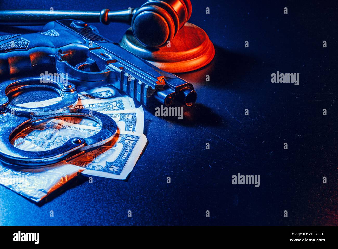 Gun and judge's gavel on the table. Crime, robbery, attack concept Stock Photo - Alamy