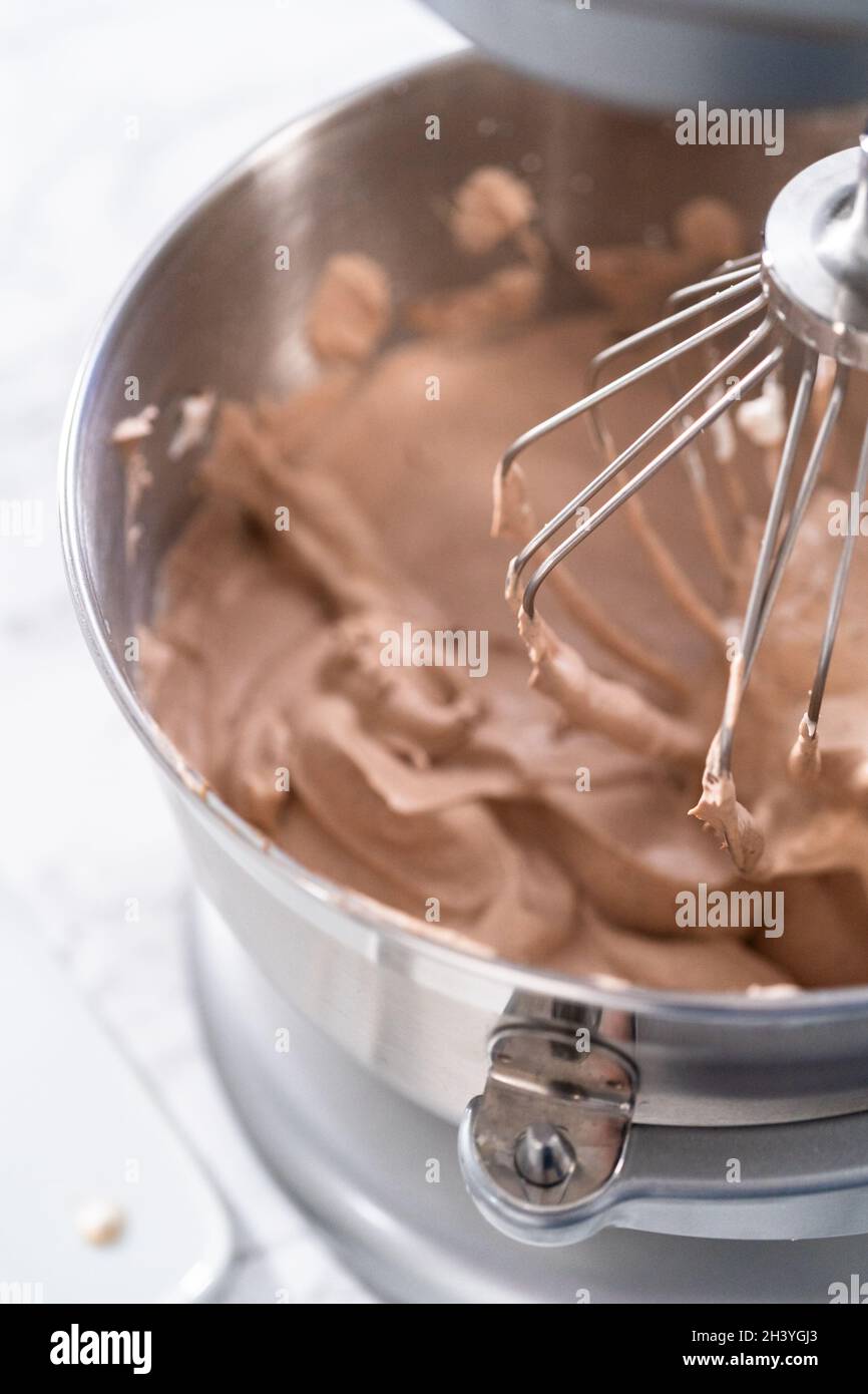 Mixing ingredients in a standing kitchen mixer to make homemade ...