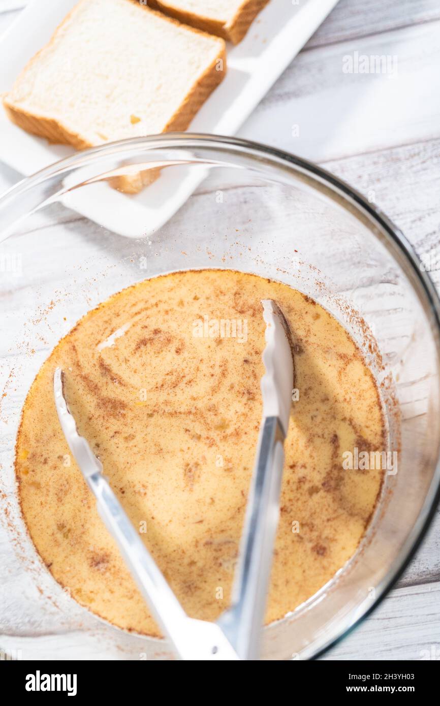 French toast batter in a large glass mixing bowl Stock Photo - Alamy