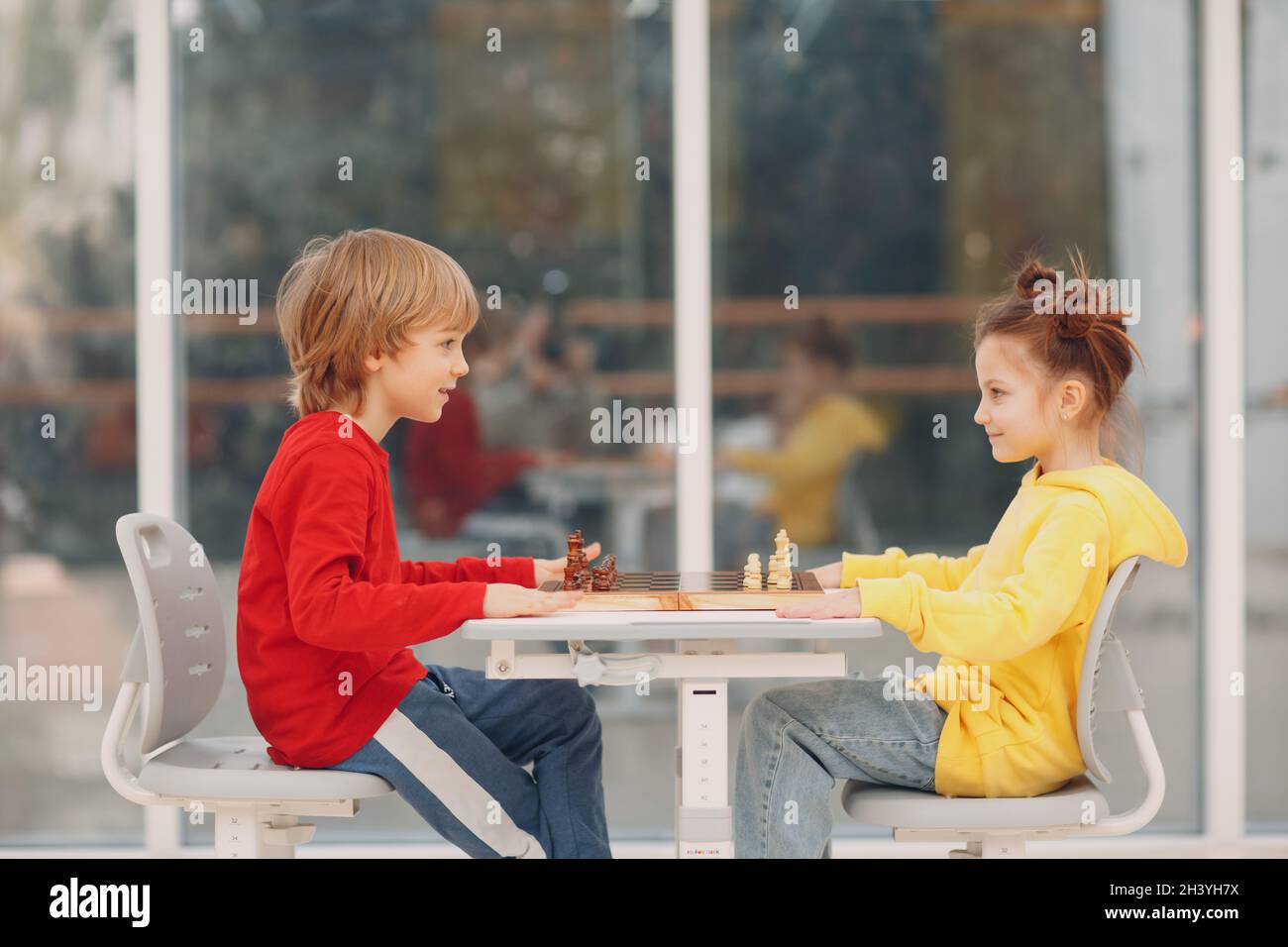 Little kids playing chess at kindergarten or elementary school Stock ...