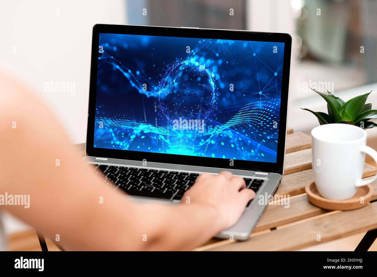 Hand Busy Typing On His Laptop Beside Coffe Mug And Plant Accomplishing ...