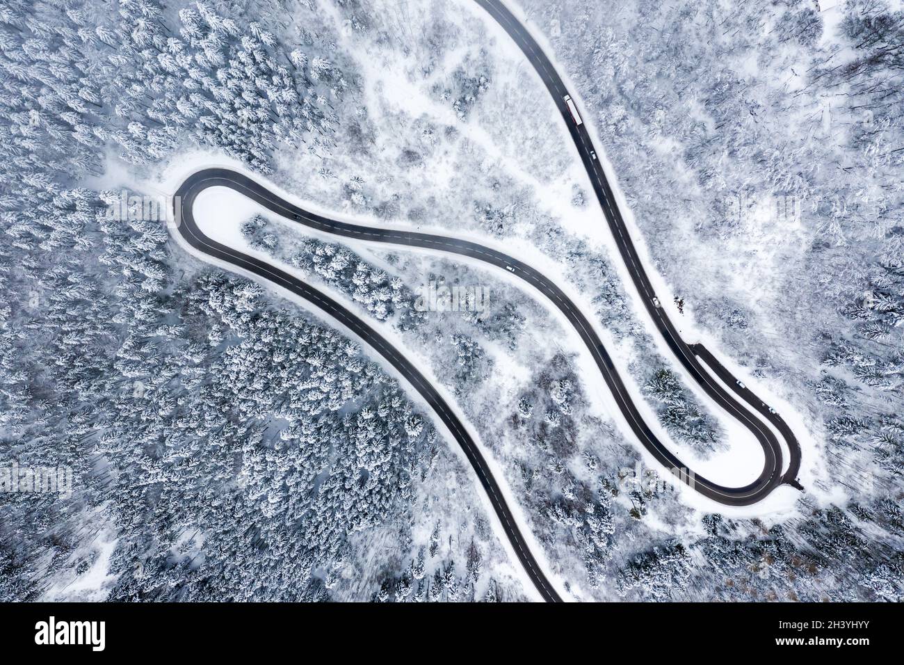 Winter snow road serpentine S-curve curves Lochenpass forest season ...