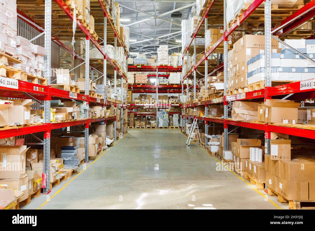 Modern warehouse shelves with pile of cardboard boxes Stock Photo - Alamy