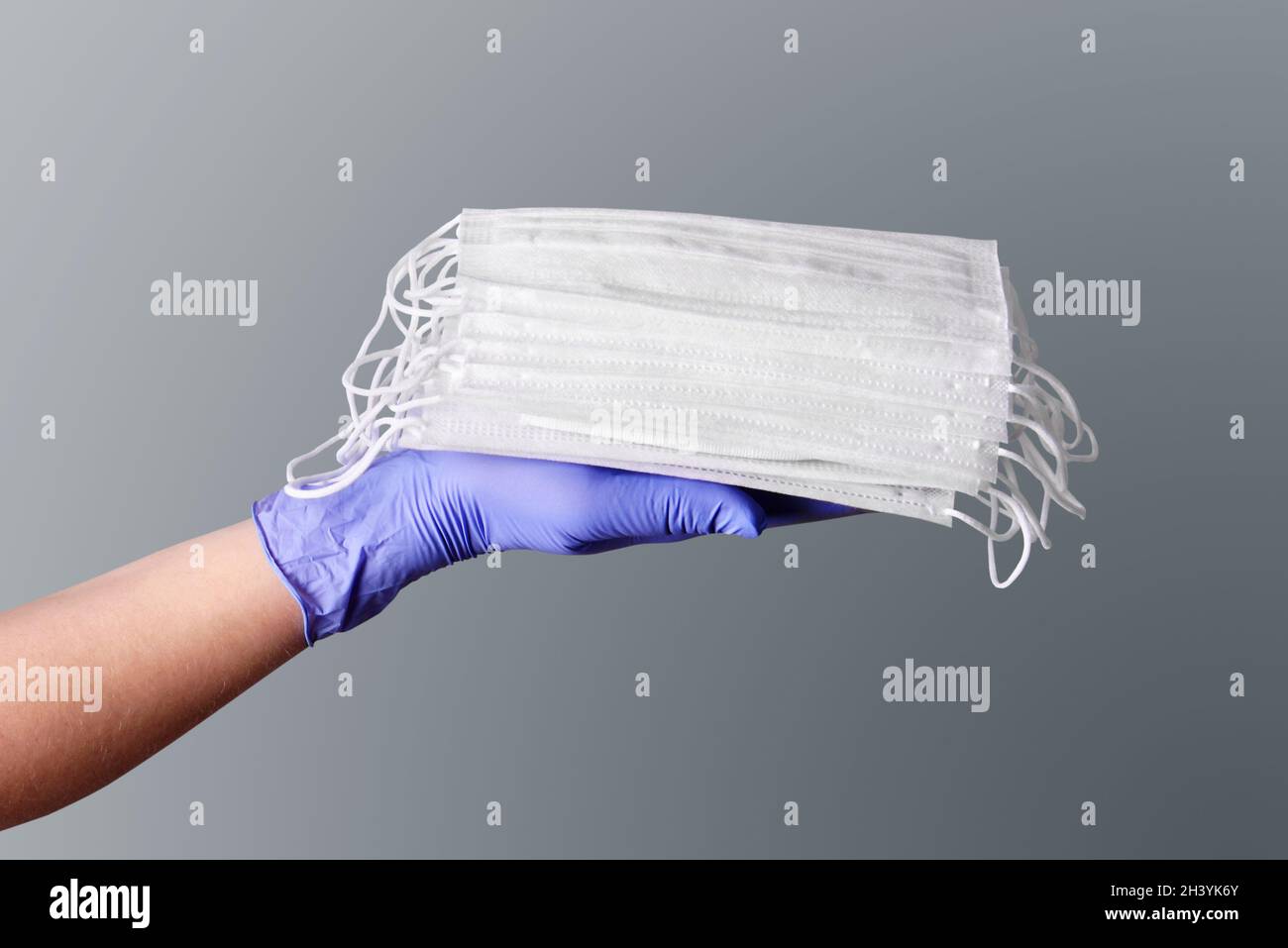 Doctor hand in medical glove hi-res stock photography and images - Alamy