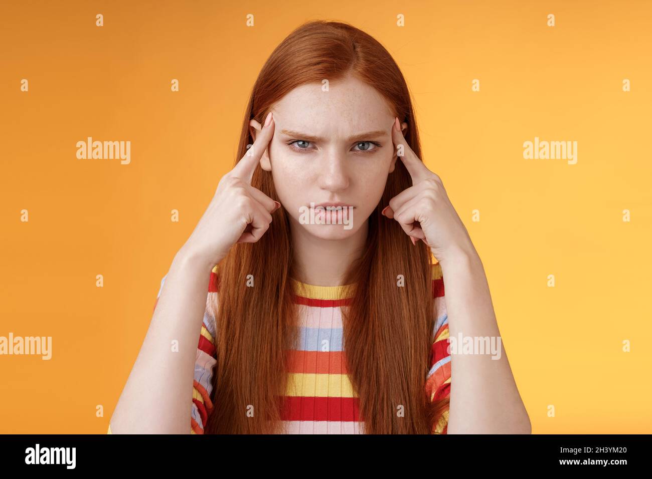 Puzzled serious-looking stressed-out young tired female student ...