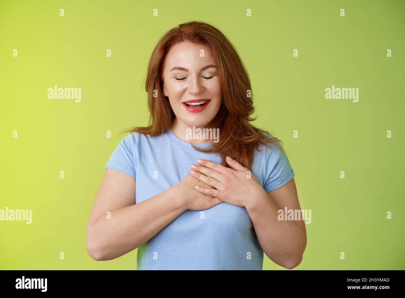 Fascinated cute redhead passionate middle-aged woman sighing lovely ...