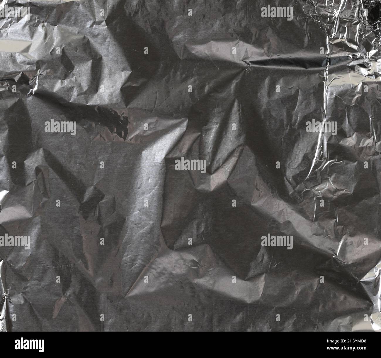 Crumpled gray foil sheet for food packaging Stock Photo - Alamy