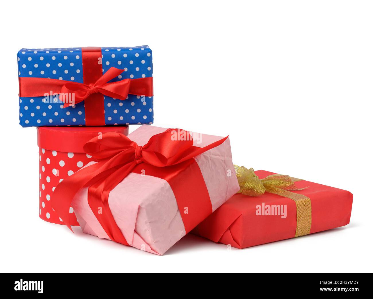 Stack of boxes wrapped in paper and tied with a silk ribbon on a white ...
