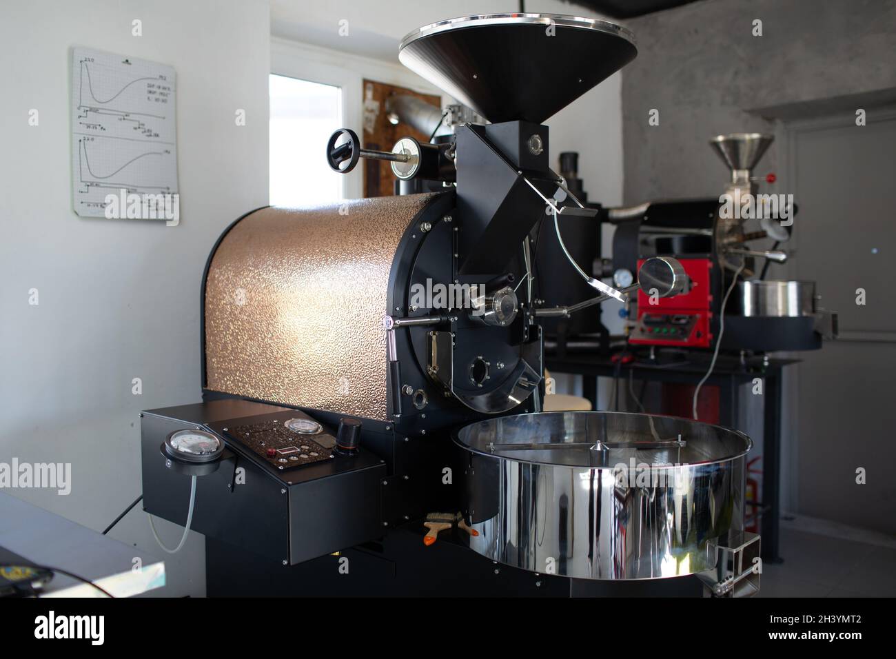 Coffee roaster machine at coffee roasting process Stock Photo - Alamy
