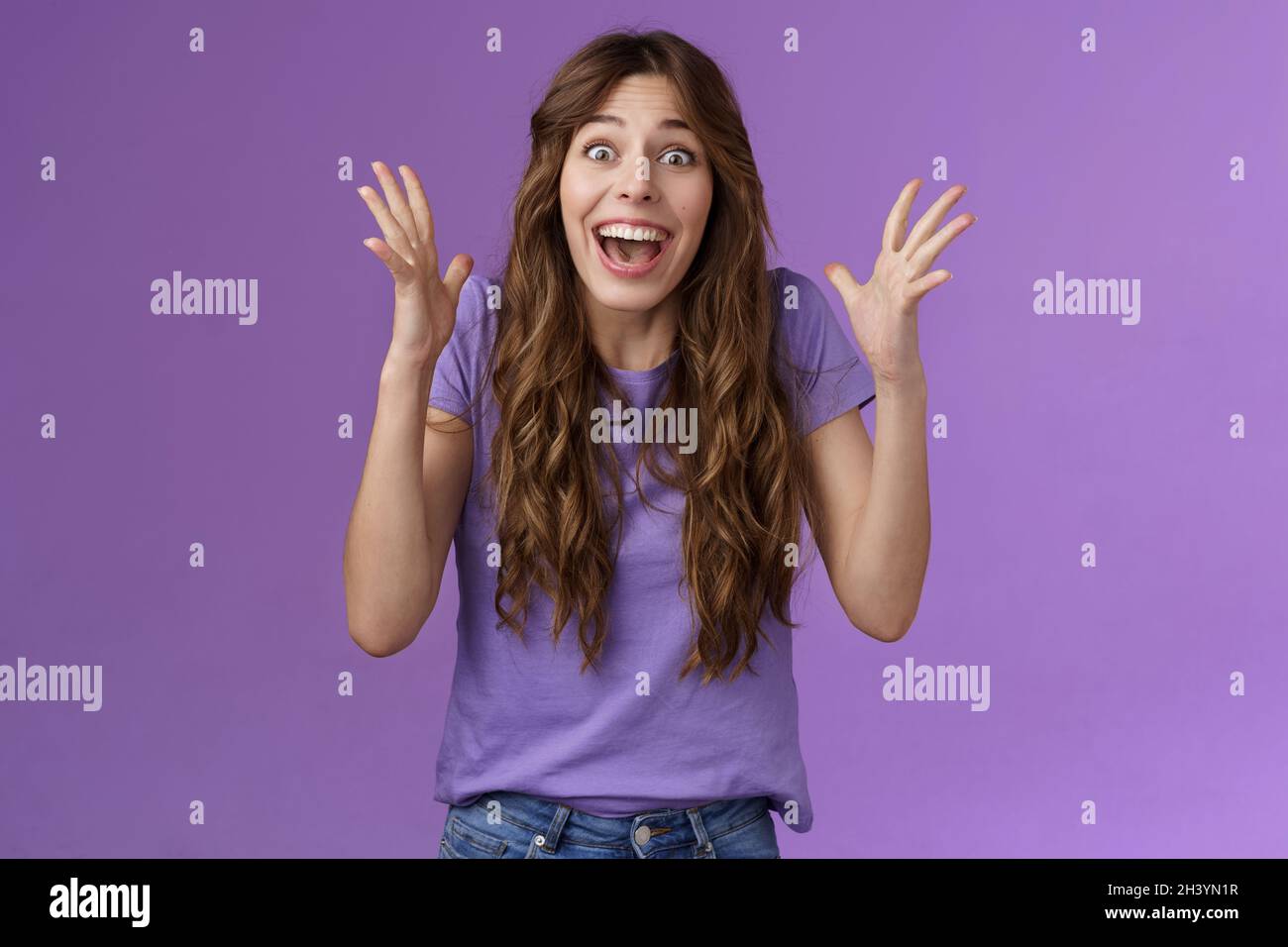 Cheerful surprised happy girl receive unbelievable super prize winning ...