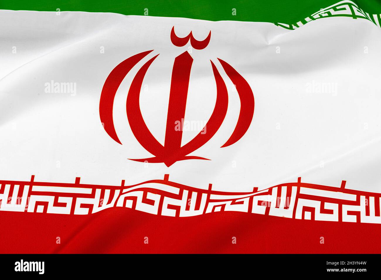 Photo of fabric flag of Iran close up Stock Photo - Alamy