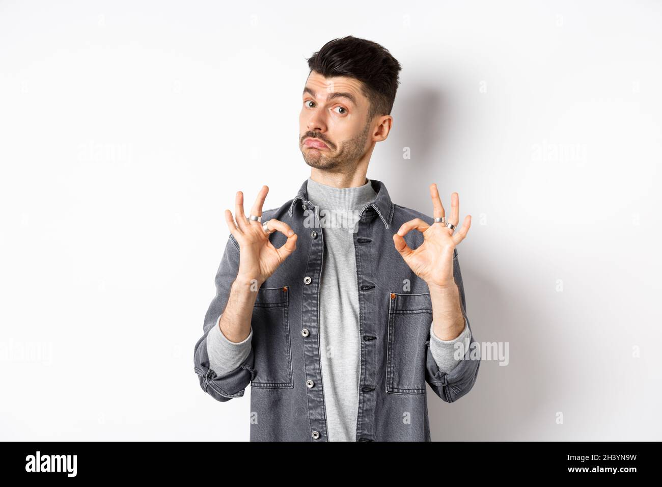 Not bad. Impressed handsome guy nod in approval, showing okay signs to ...