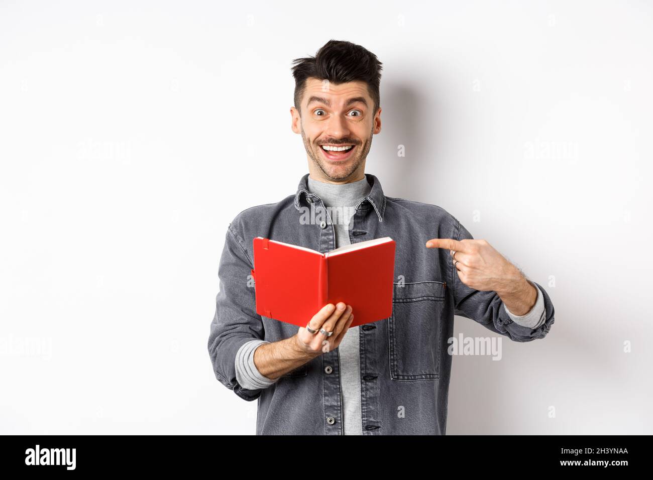 Bearded man pointing book hi-res stock photography and images - Alamy