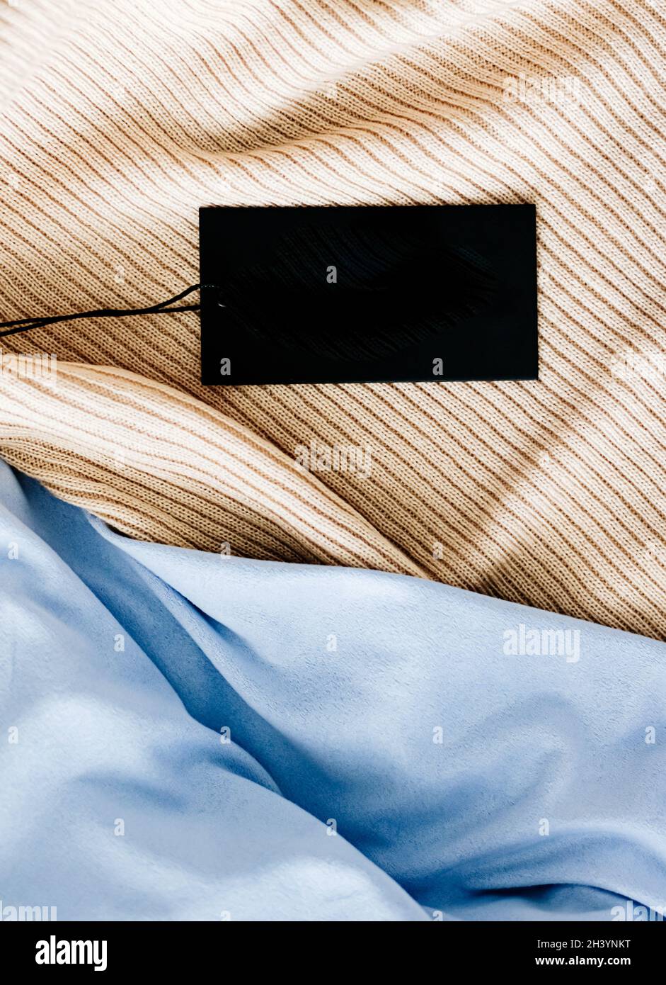 Black horizontal price tag on fabrics Stock Photo - Alamy