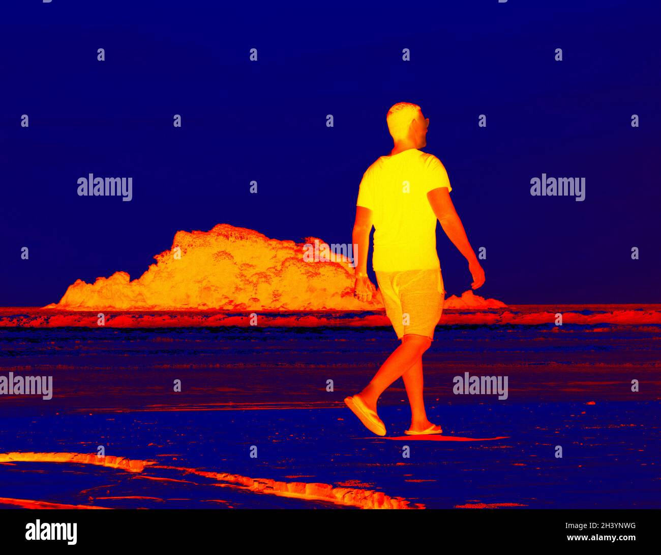 Walking man infrared Stock Photo - Alamy