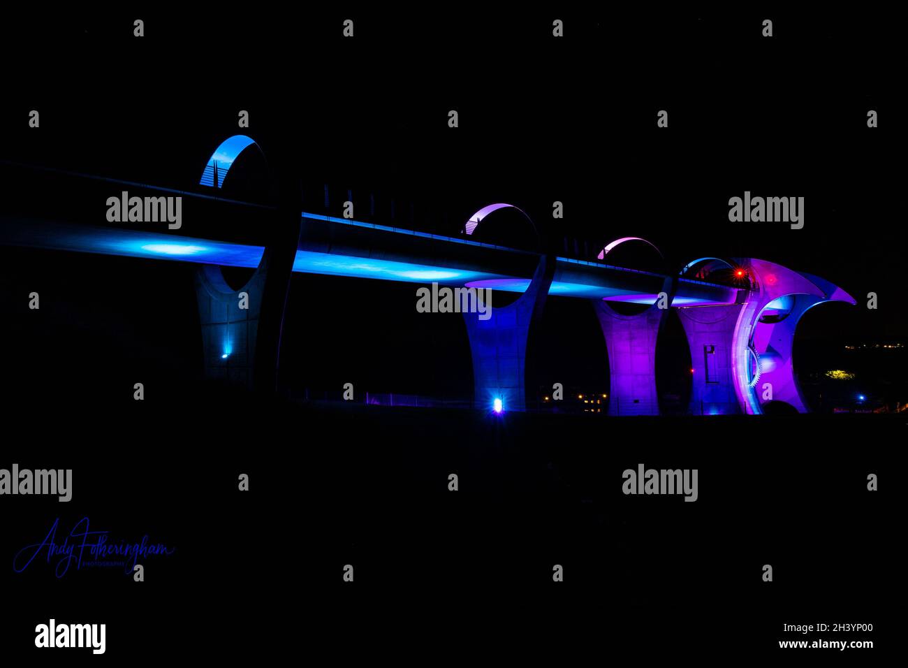 A cloroed high bridge with colored bridge supports with futuristic ...