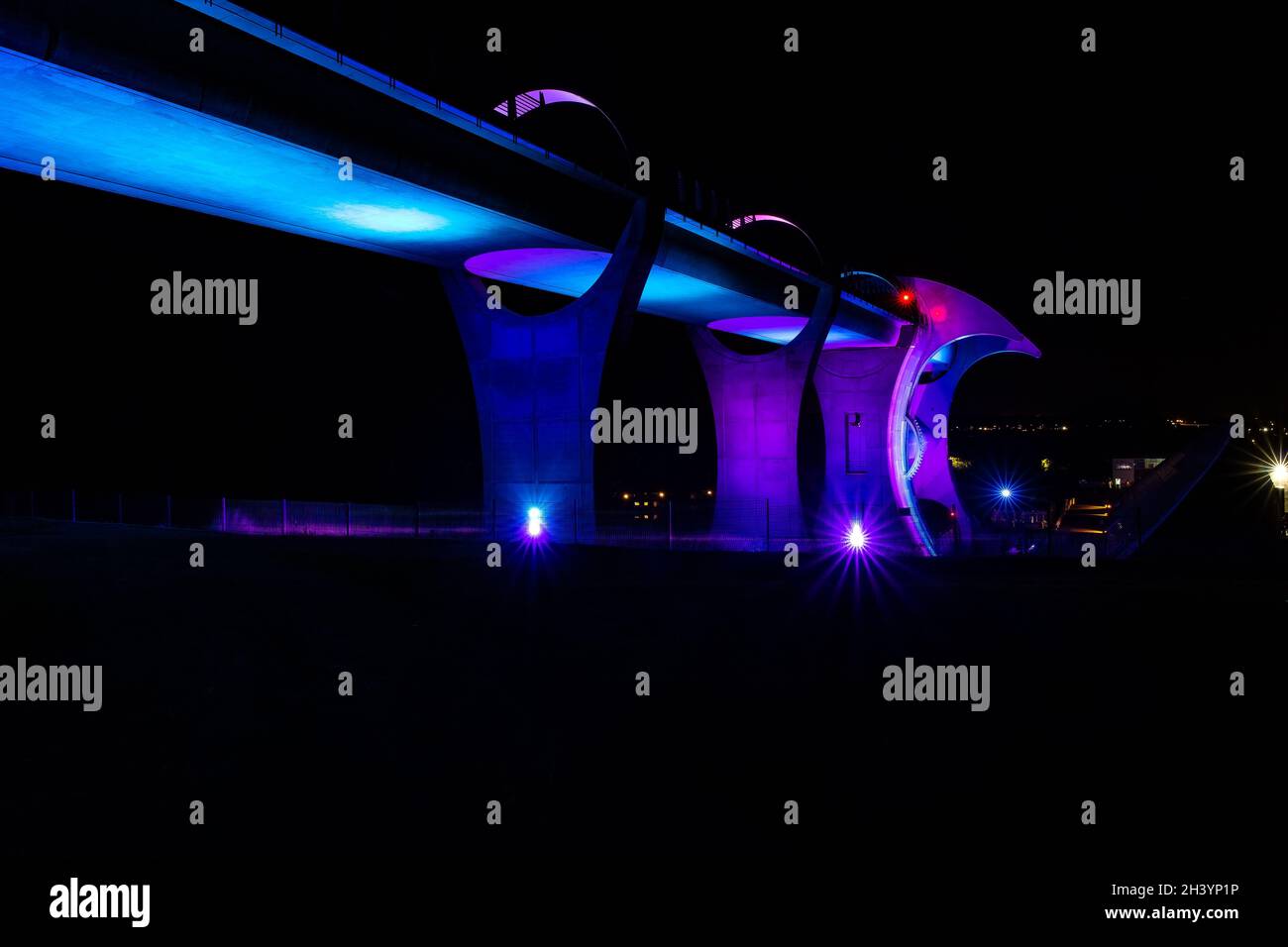 A cloroed high bridge with colored bridge supports with futuristic ...