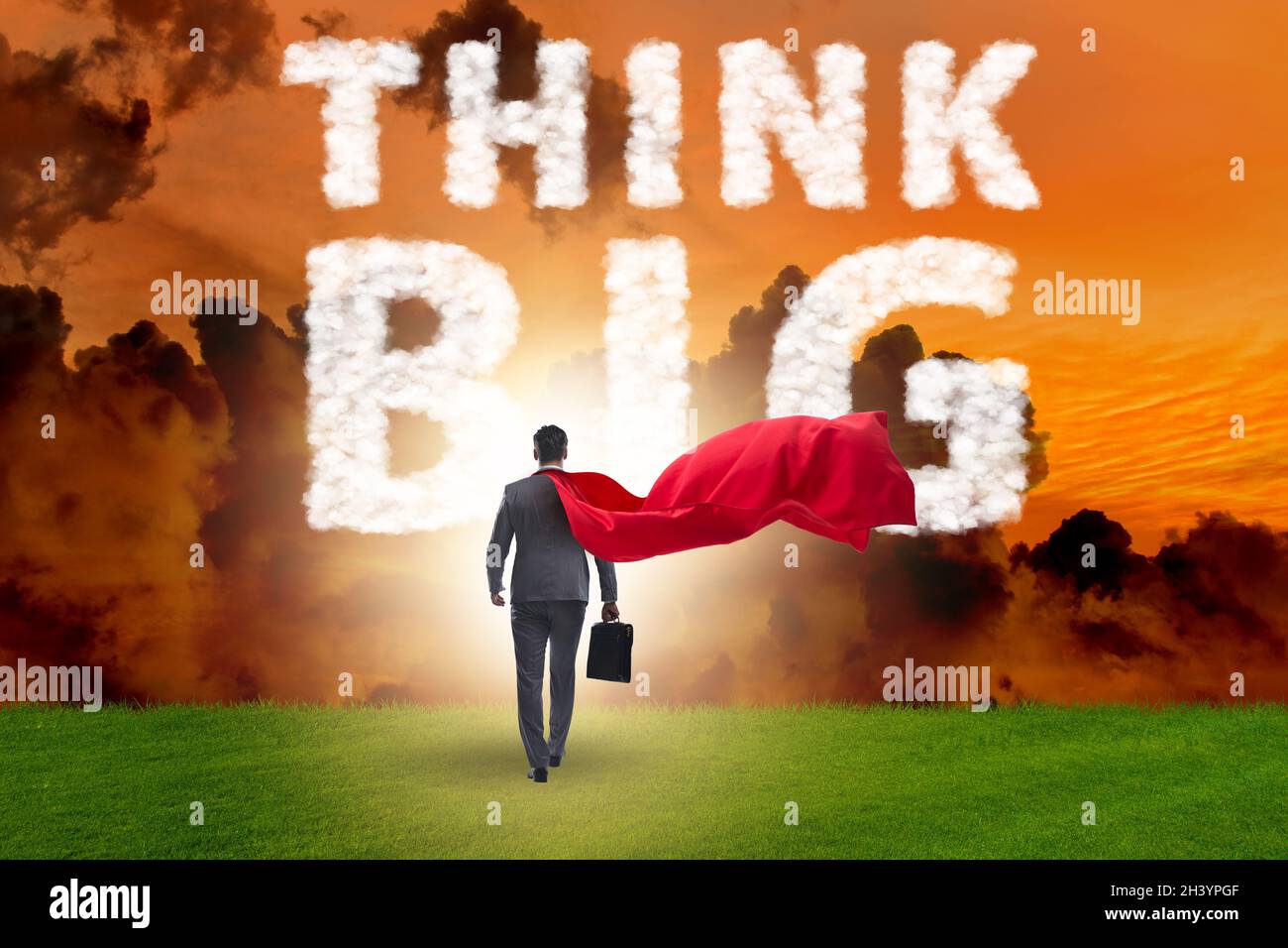 Think big concept with businessman superhero Stock Photo - Alamy