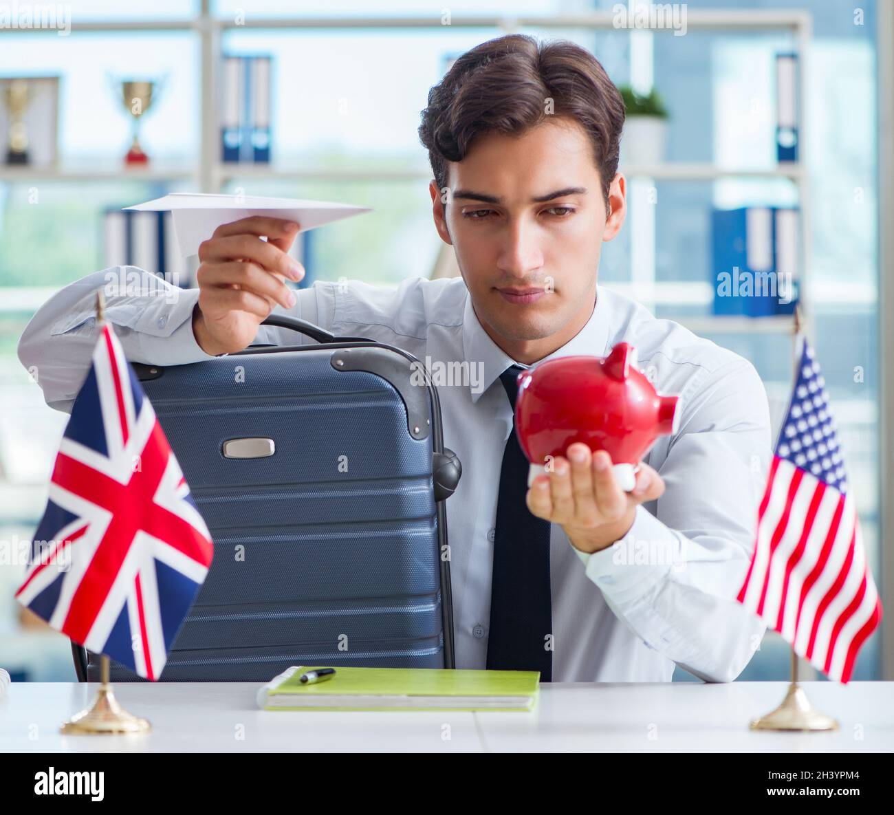 Sales agent working in travel agency Stock Photo - Alamy