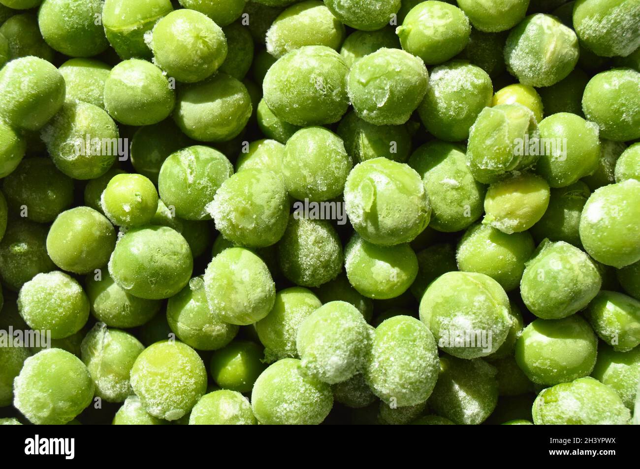 Fresh green frozen peas and grains, nutritious and healthy green ...